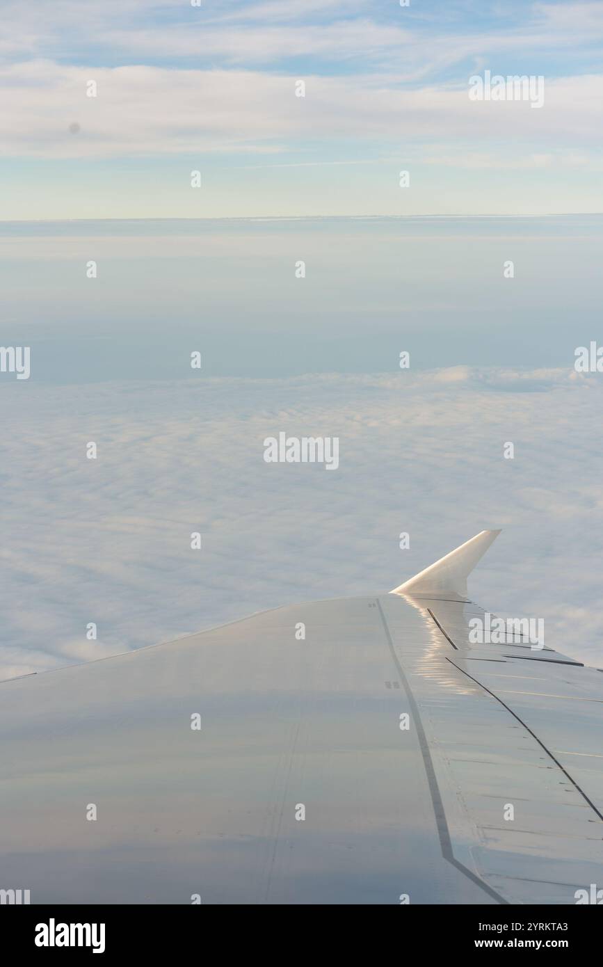 Aerial view from inside a modern jet airplane, with the wing visible ...