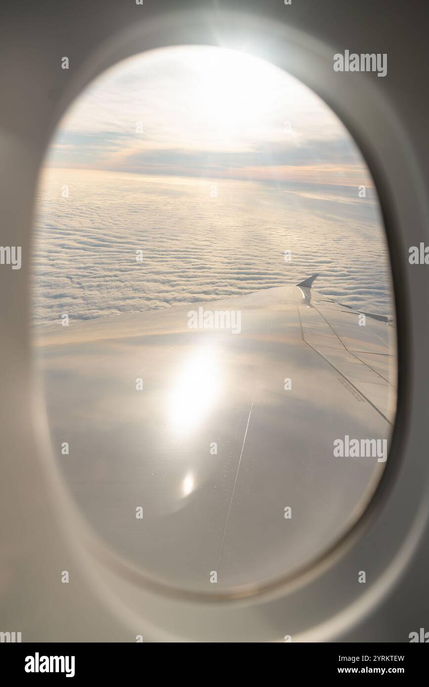 Aerial view from inside a modern jet airplane, with the wing visible ...