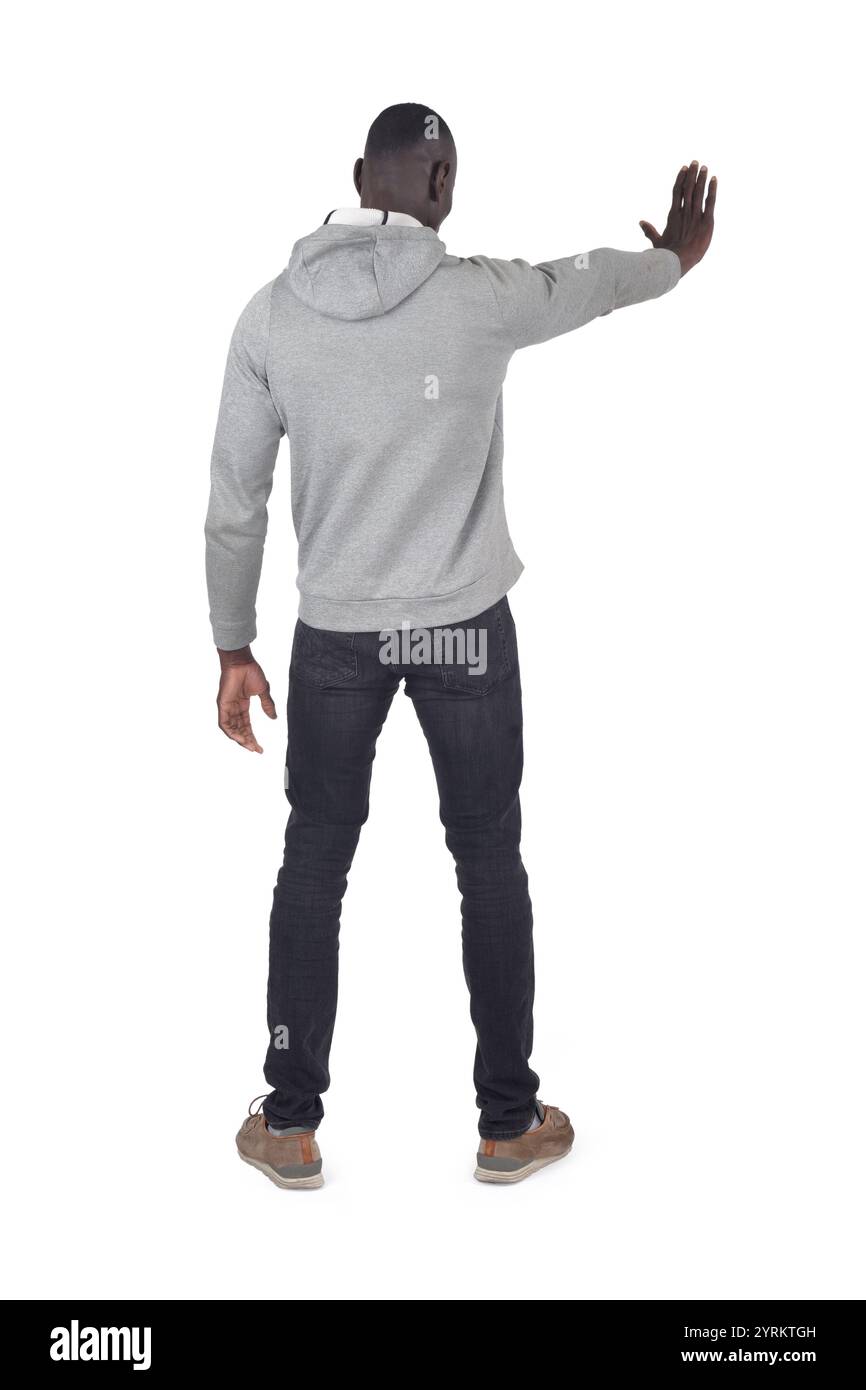 back view of a man showing stop sign on white background Stock Photo ...