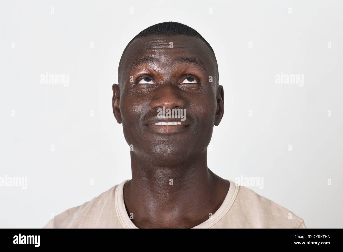 front face portrait of a man looking up on white background Stock Photo ...