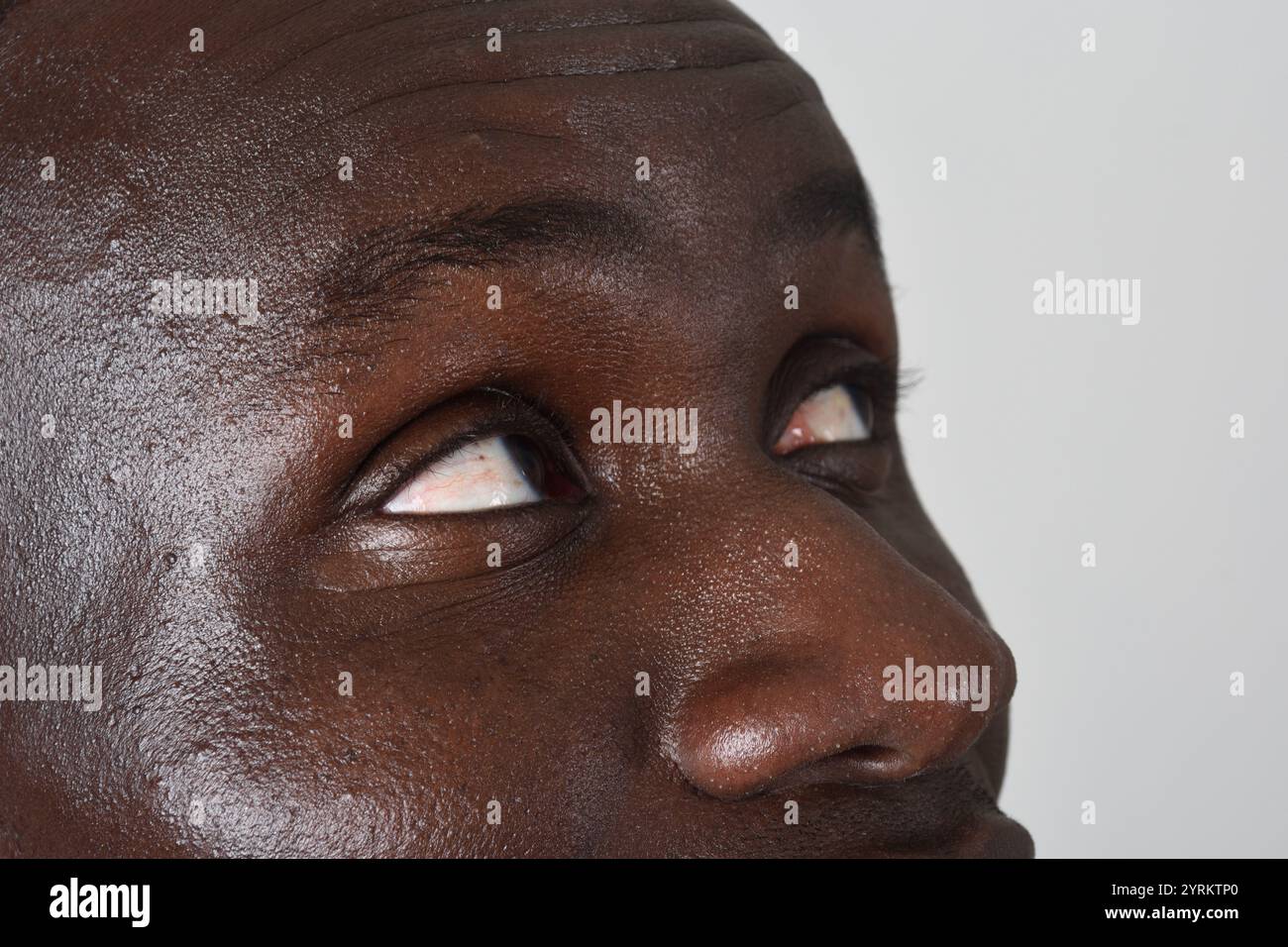 side view of a detail of a man's eyes look away Stock Photo - Alamy