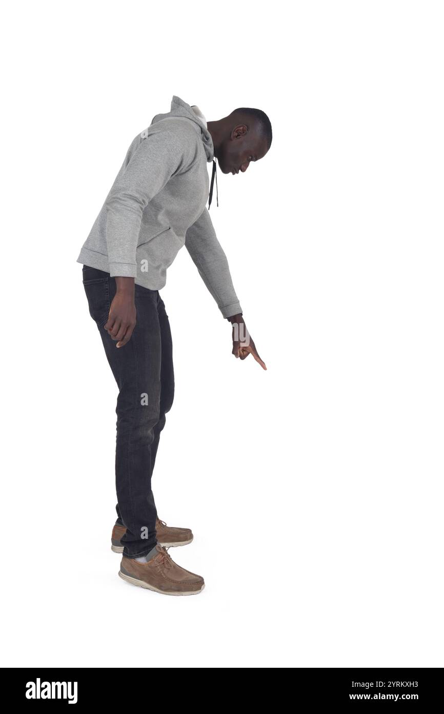 side view of a man pointing down on white background Stock Photo - Alamy