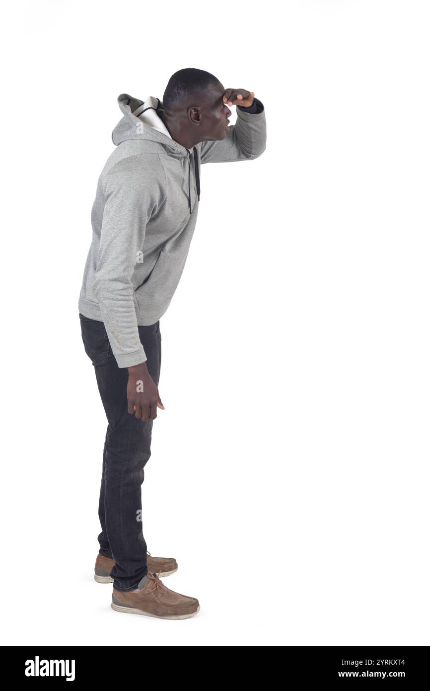 side view of a a man hand on forehead looking away on white background ...