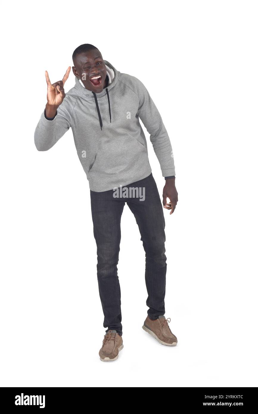 front view of a man showing the horns sign with fingers, looking at ...