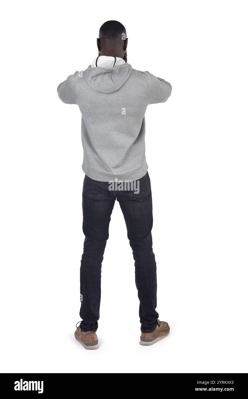 back view of a man covering her face with her hand on white background ...