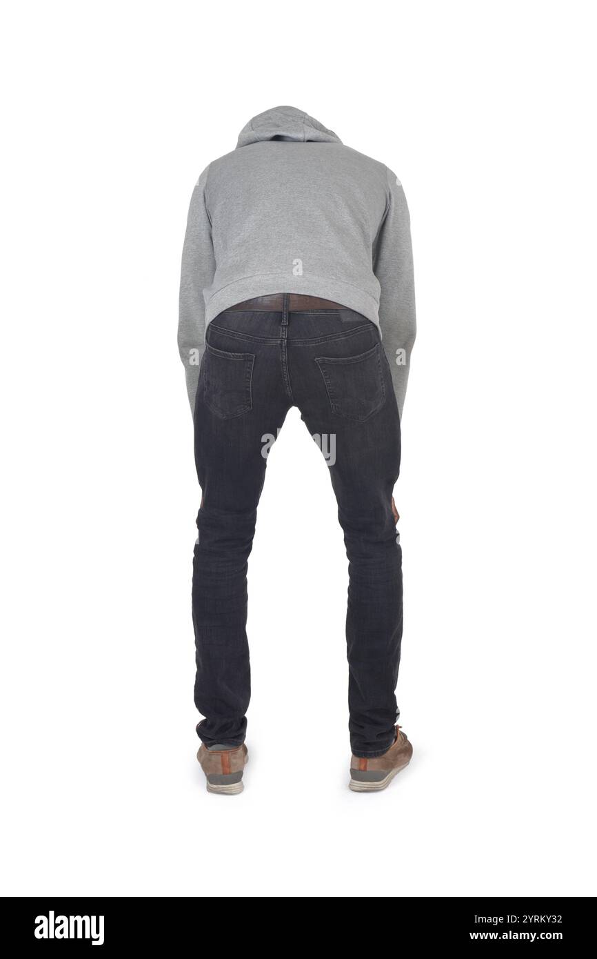 back view of a man crouched down and looking the floor on white ...