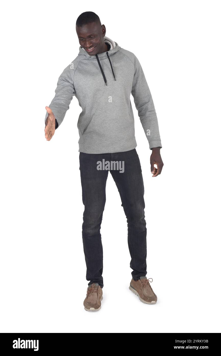 front view of a man shaking hands with an imaginary person on white ...