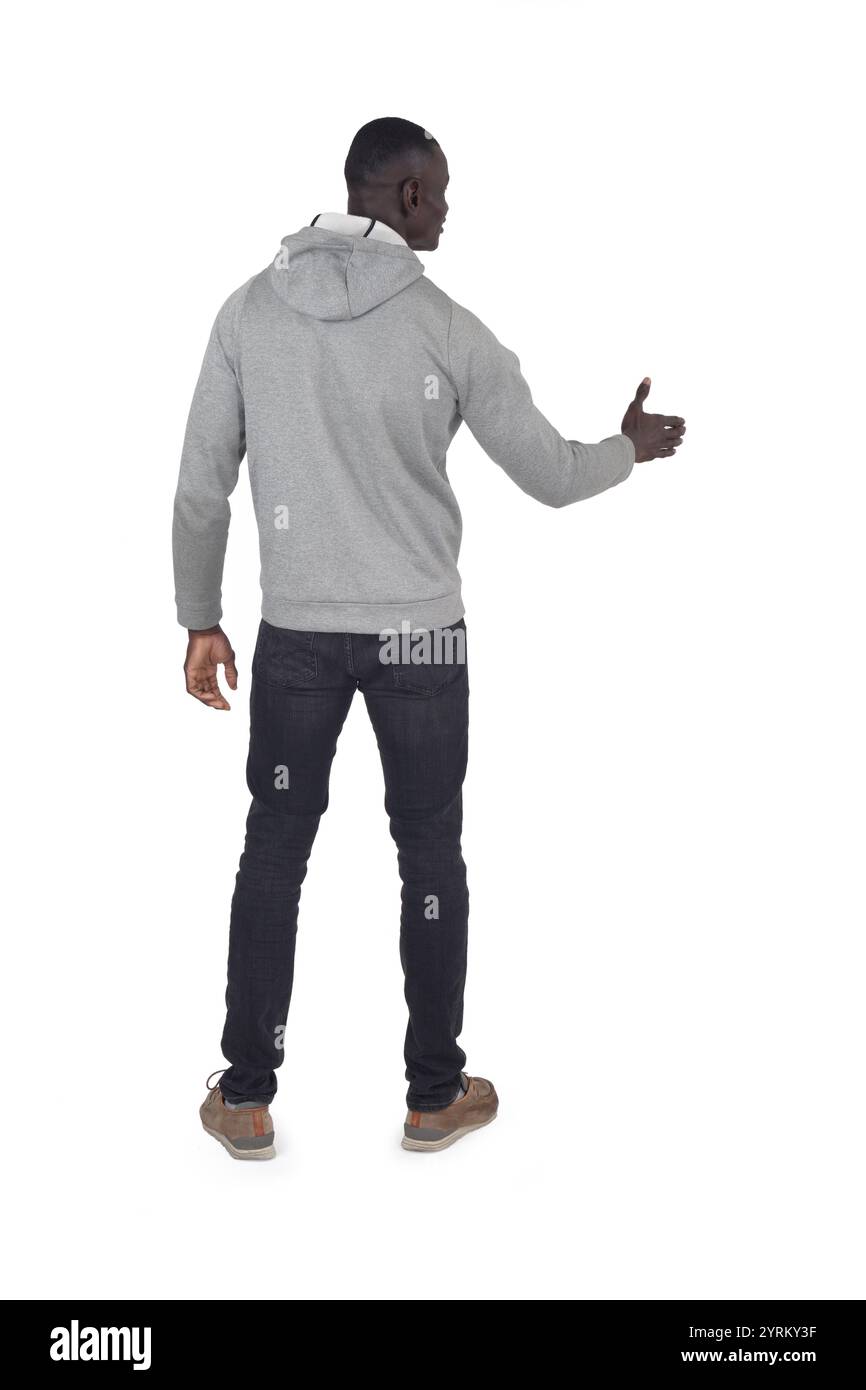 back view of a man shaking hands with an imaginary person on white ...