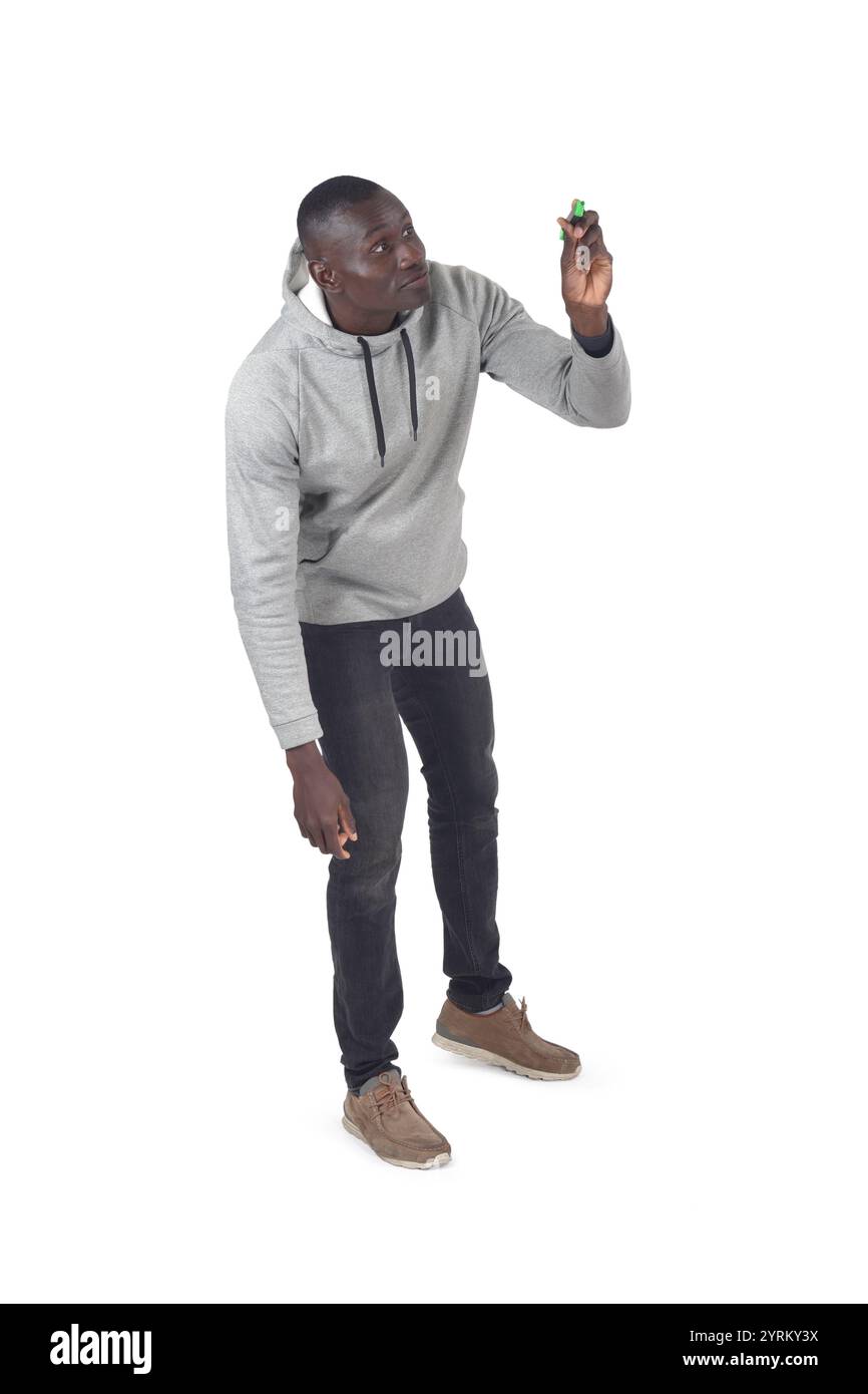 side view of a crouching man drawing or writing imaginatively Stock ...