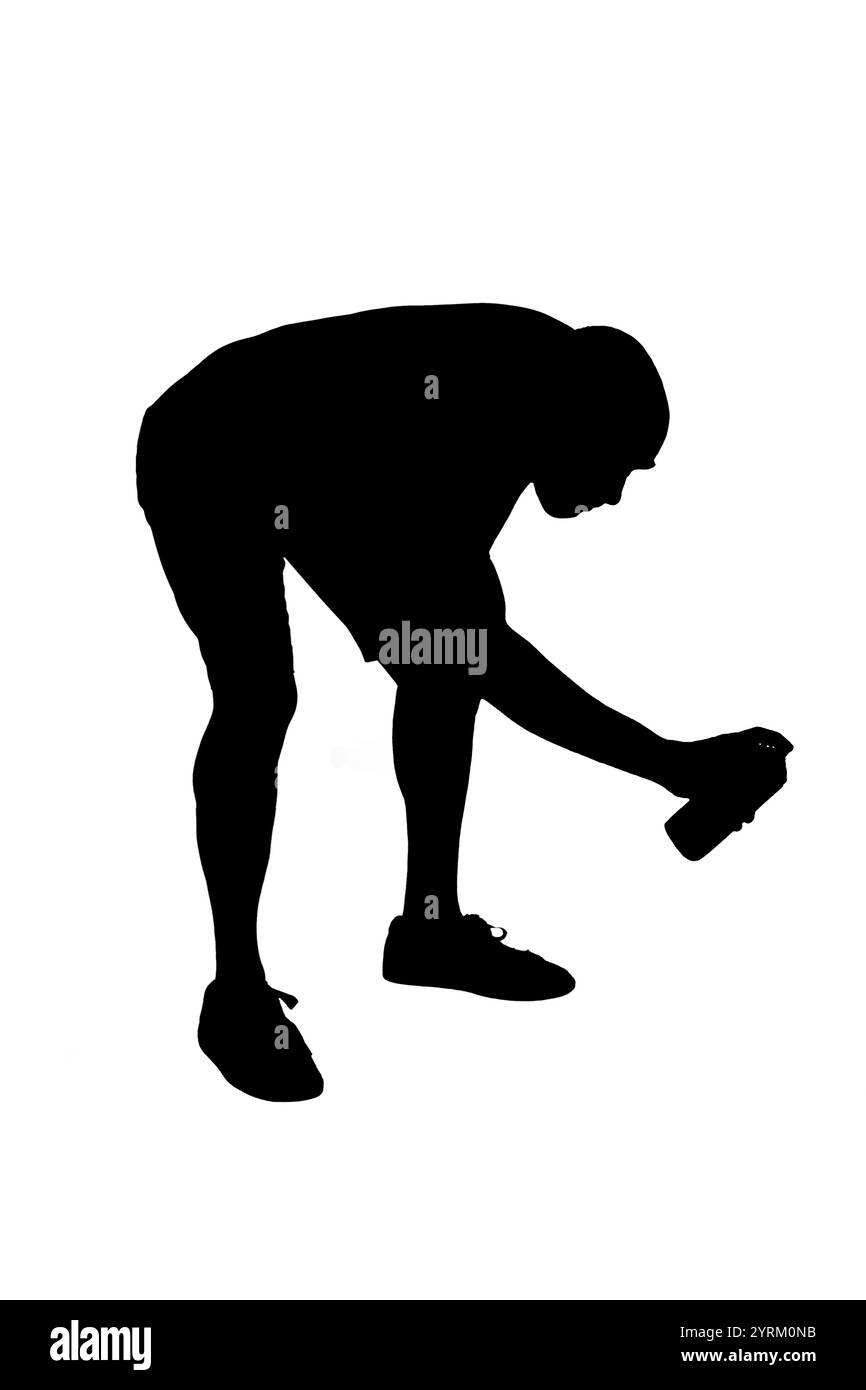 silhouette of a man crouching painting with spray paint on white ...