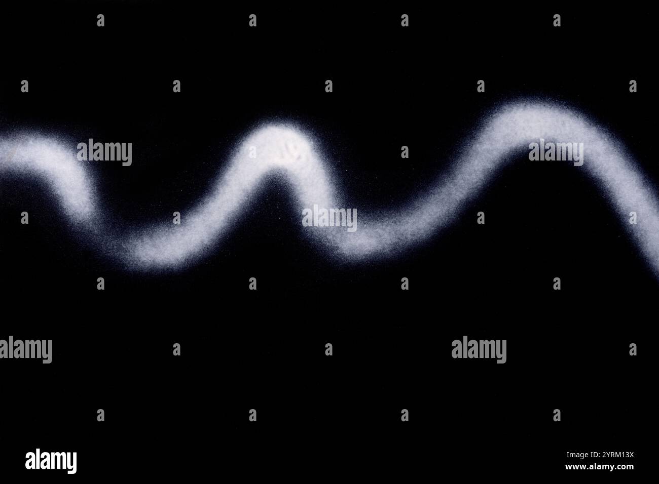 wavy line of white spray paint on black paper background Stock Photo ...