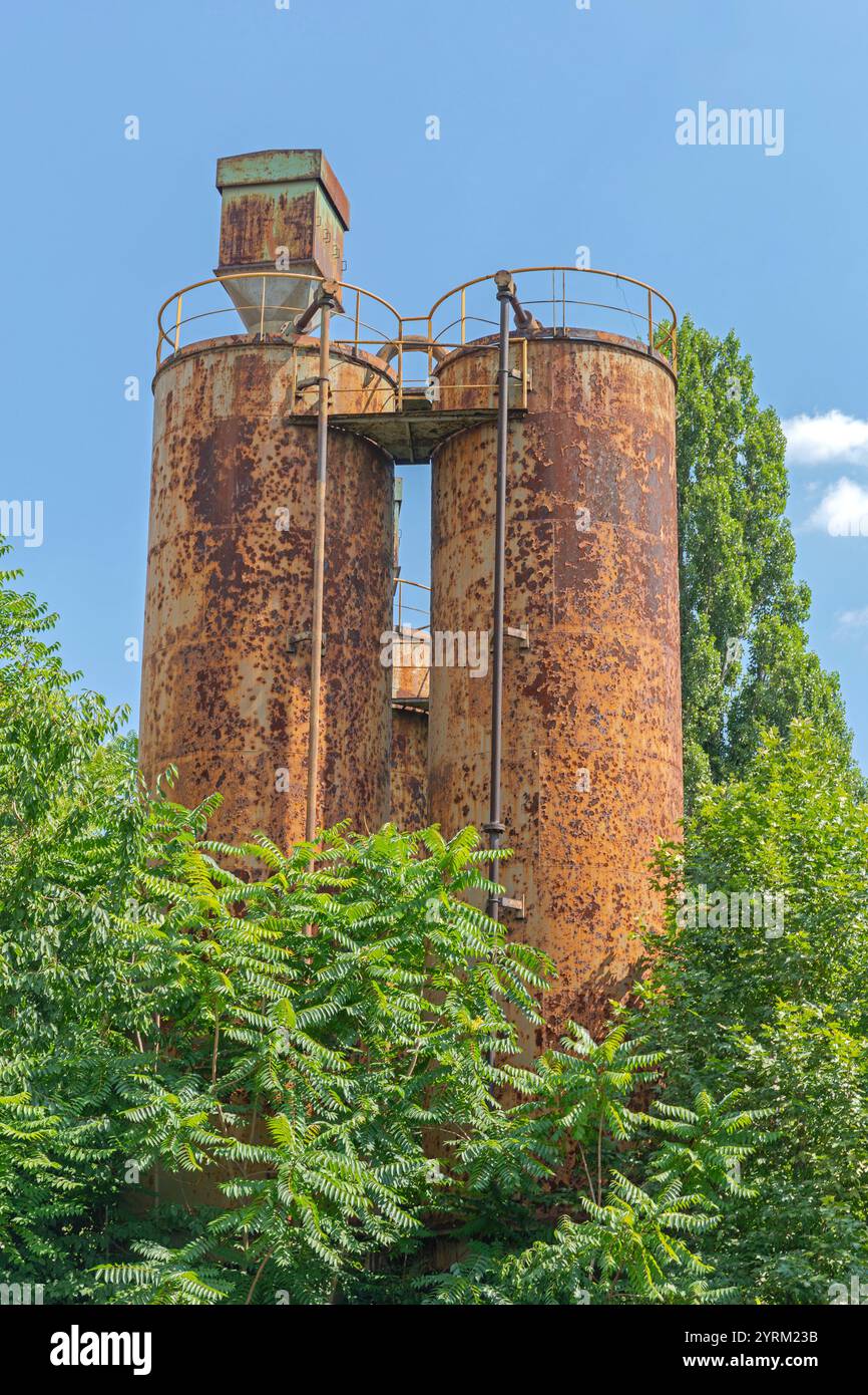 Rusty Silo Storage Tank at Abandoned Industrial Facility Overgrown ...