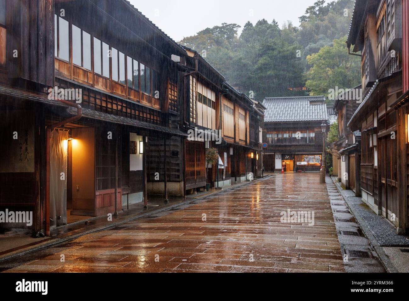A serene scene of a rainy day in a traditional Japanese village ...