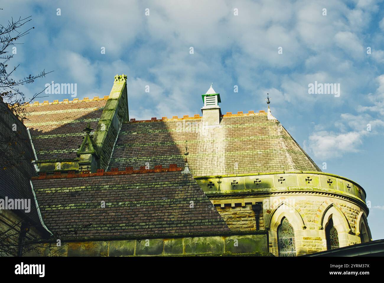 A section of a building's roof, featuring different roof sections ...