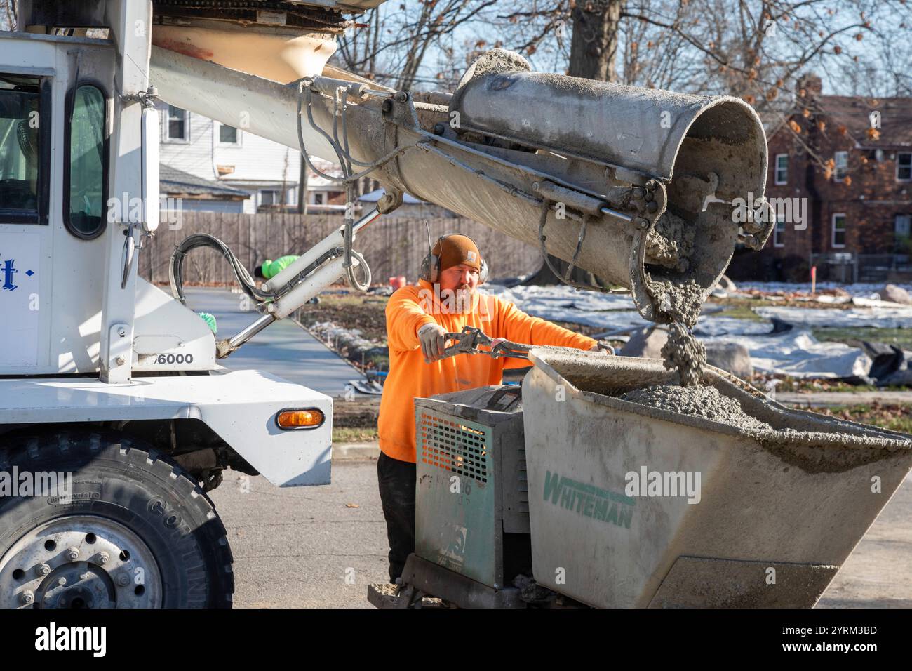 Detroit, Michigan - Workers pour and finish concrete for walking paths ...