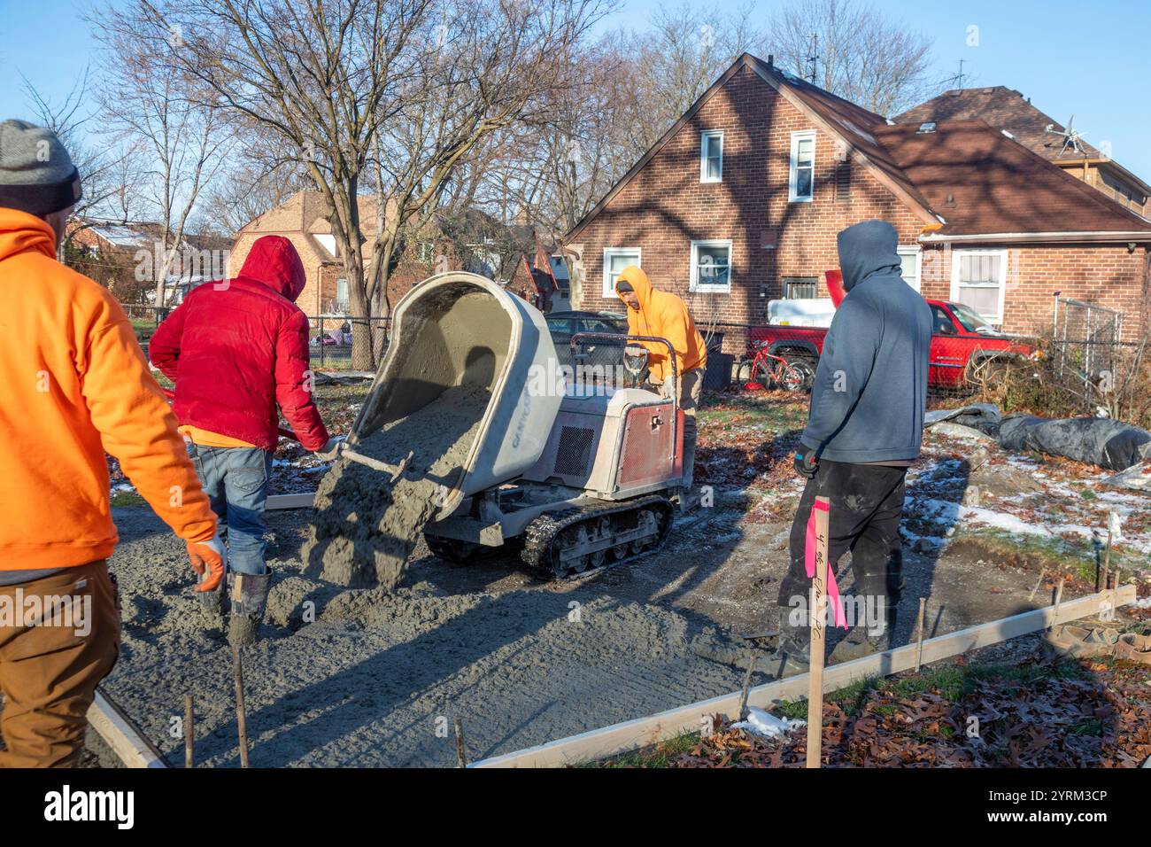 Detroit, Michigan - Workers pour and finish concrete for walking paths ...