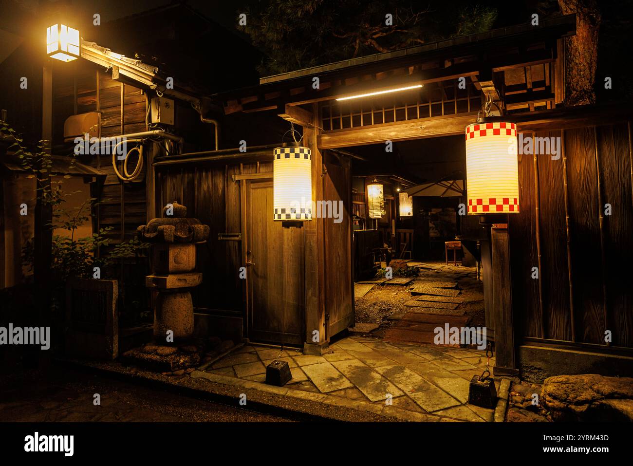 A serene nighttime view of illuminated lanterns at a traditional ...