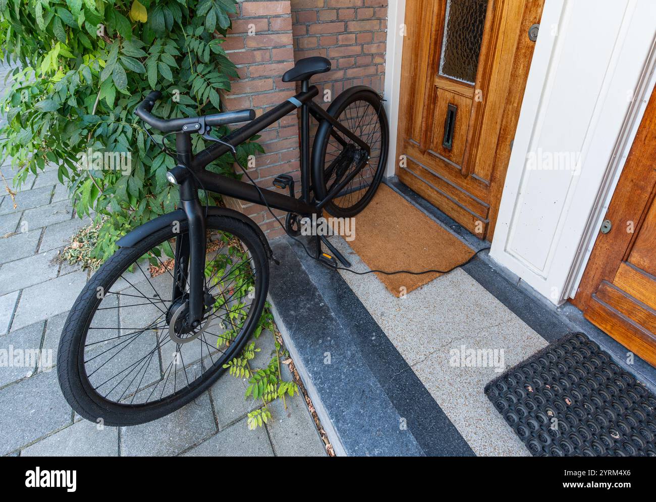 Amsterdam, The Netherlands, 28.08.2024, Charging modern electrical bike, e-bike getting ready ...