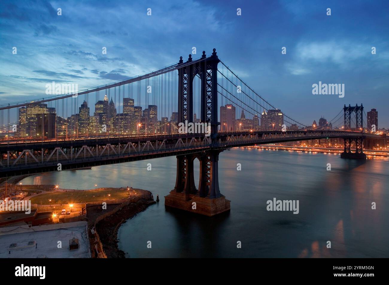 Aerial view from Brooklyn at dusk. Manhattan and Brooklyn bridges and ...
