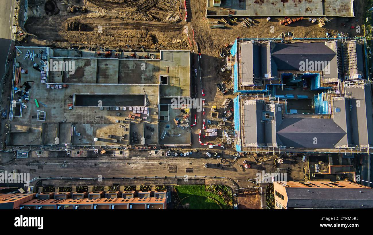 Aerial view of a construction site showing two buildings under ...