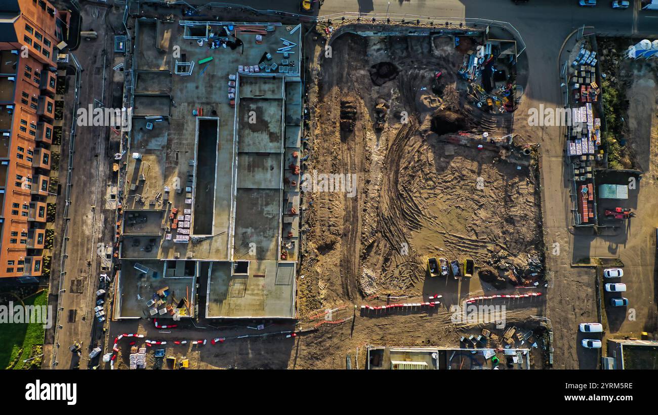 Aerial view of a construction site showing an excavated area, partially ...