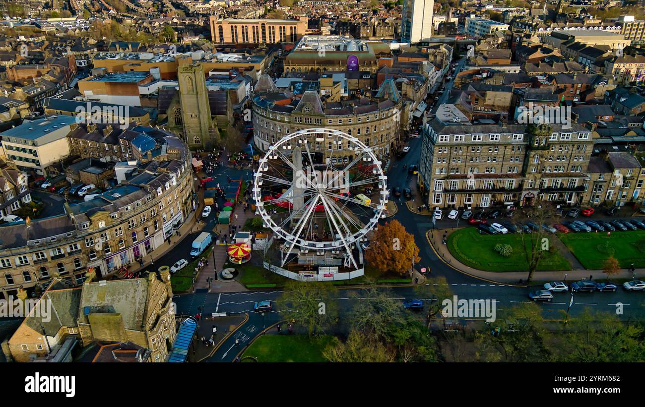 Aerial view of a city center with a Ferris wheel situated in a town ...