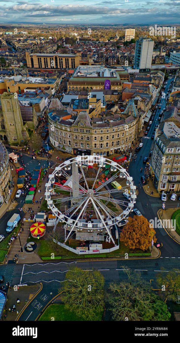 Aerial view of a city center with a Ferris wheel, Christmas market ...