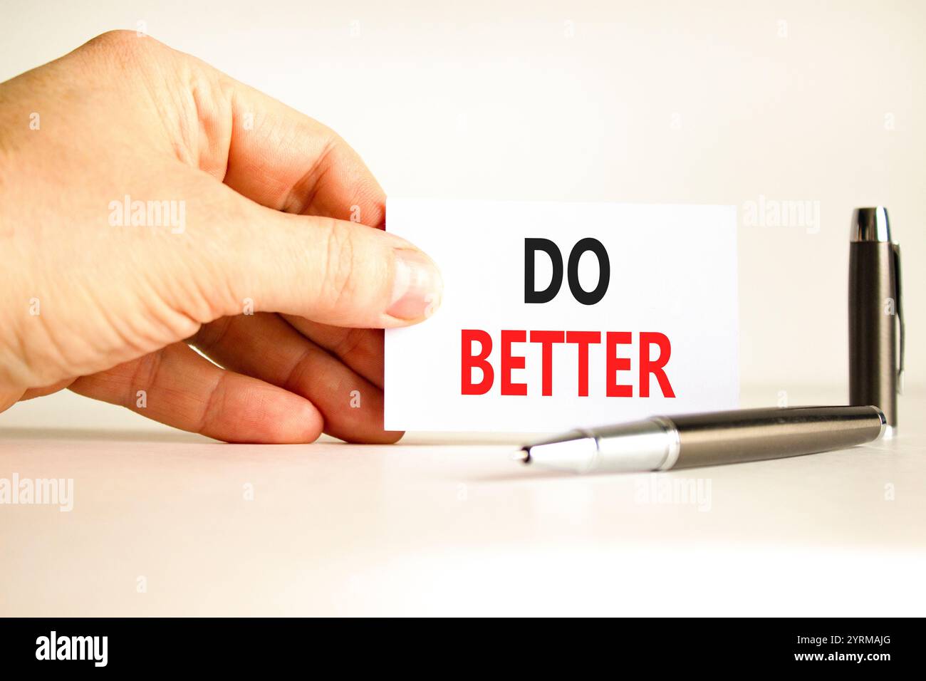 Do better symbol. Concept words Do better on beautiful white card ...