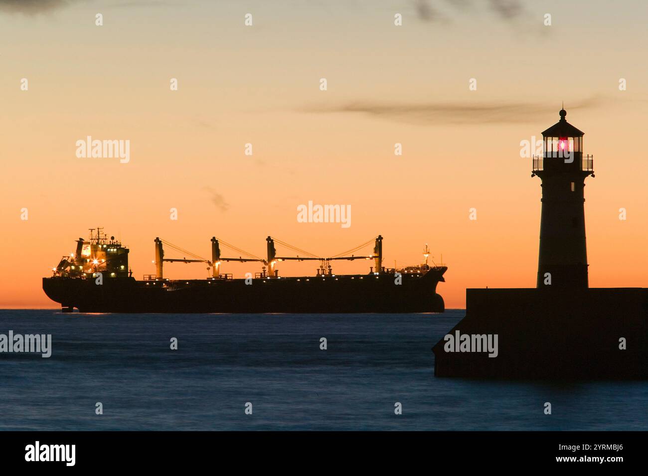 Duluth Harbor. Shipping Channel Lighthouse at Dawn with Freighter ...