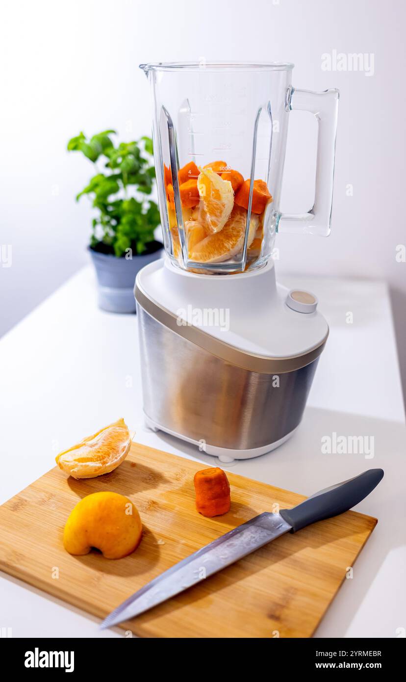 healthy eating concept, fresh vegetables and fruits in a blender, fruit ...
