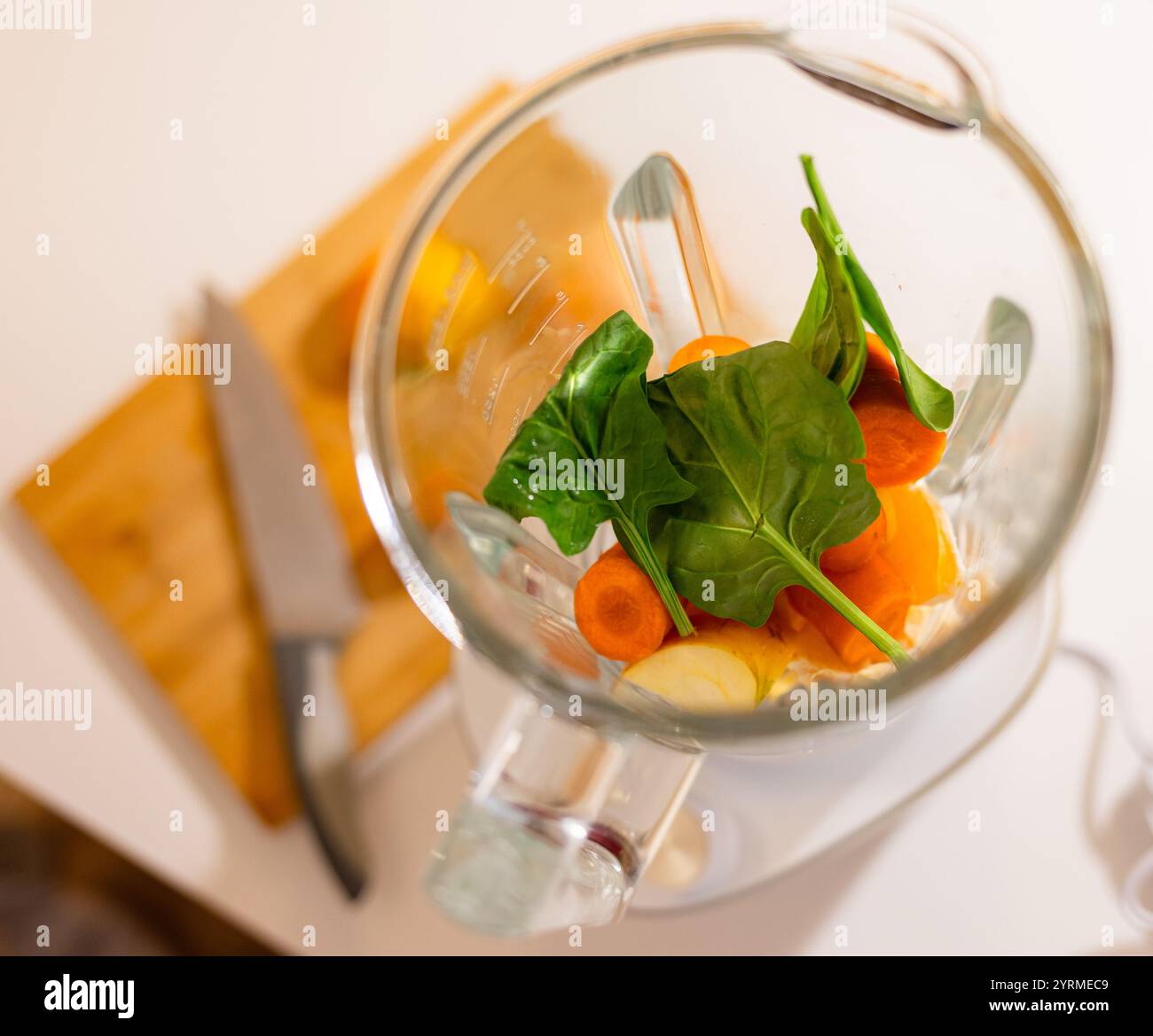 healthy eating concept, fresh vegetables and fruits in a blender, fruit ...