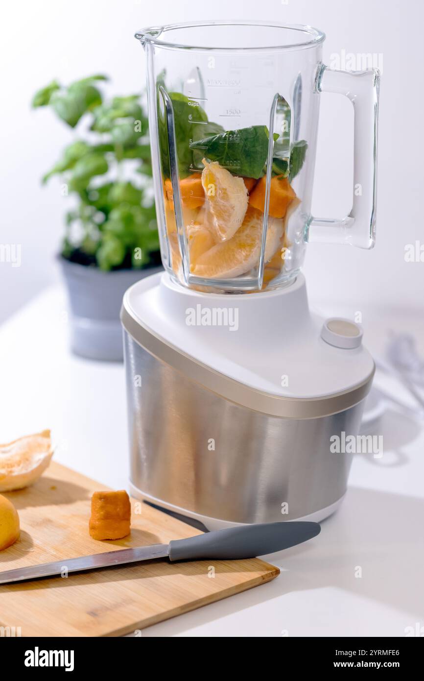 healthy eating concept, fresh vegetables and fruits in a blender, fruit ...