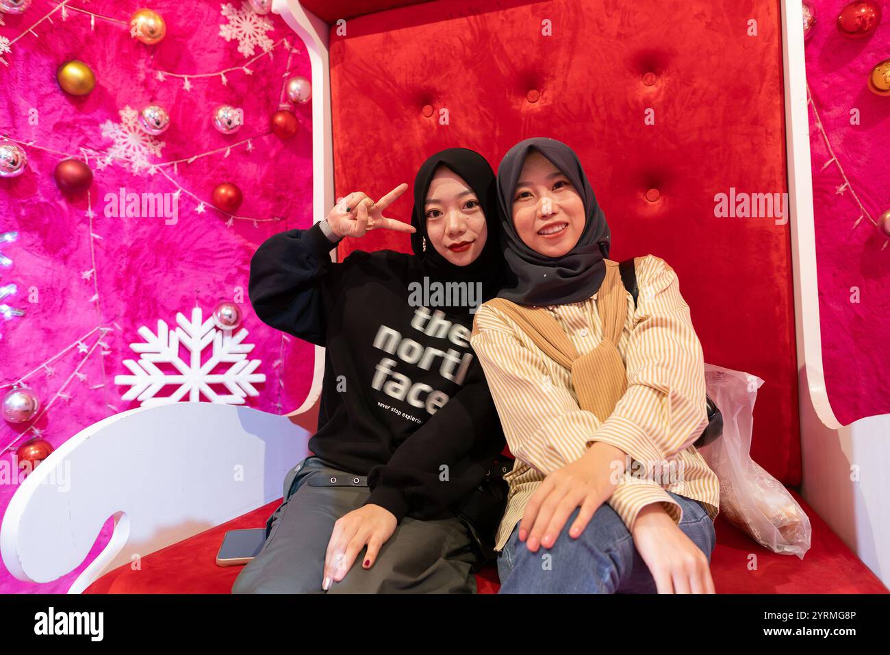 KUALA LUMPUR, MALAYSIA - DECEMBER 01, 2023: two women posing at Candy ...