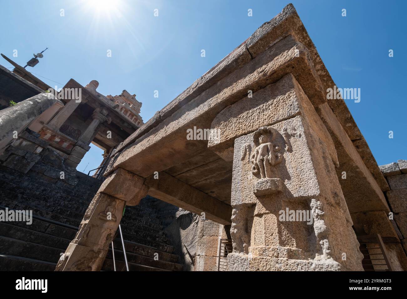 A carved stone gateway at the historic Shravanabelagola temple complex ...