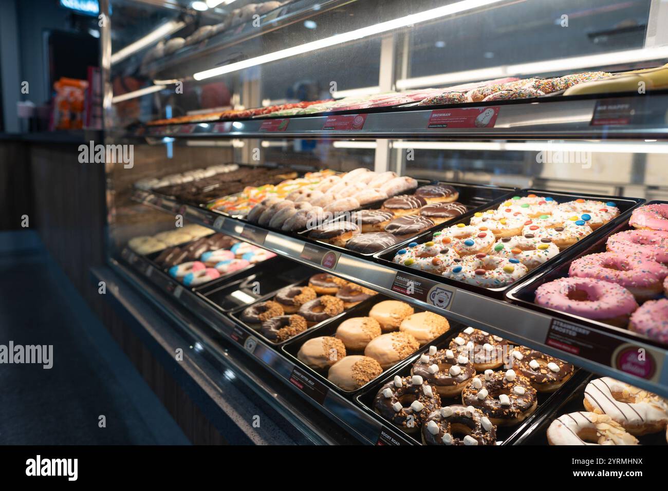 KUALA LUMPUR, MALAYSIA - NOVEMBER 28, 2023: donuts displayed in a glass ...
