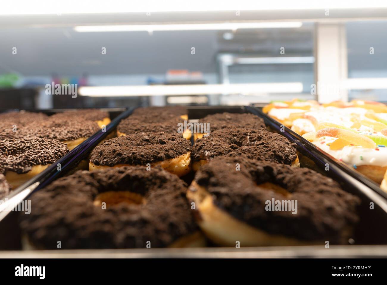 KUALA LUMPUR, MALAYSIA - NOVEMBER 28, 2023: donuts displayed in a glass ...