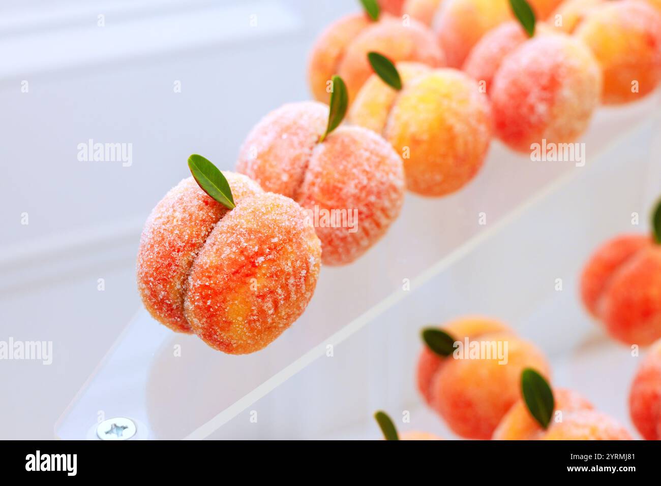 Colorful sweet fruit shaped desserts are elegantly arranged on vibrant ...