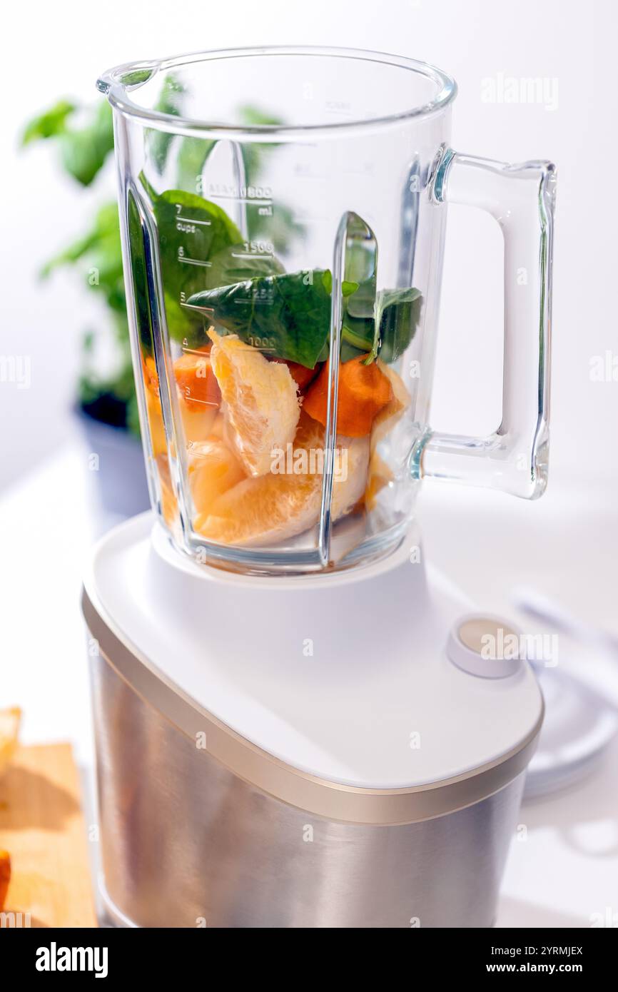 healthy eating concept, fresh vegetables and fruits in a blender, fruit ...