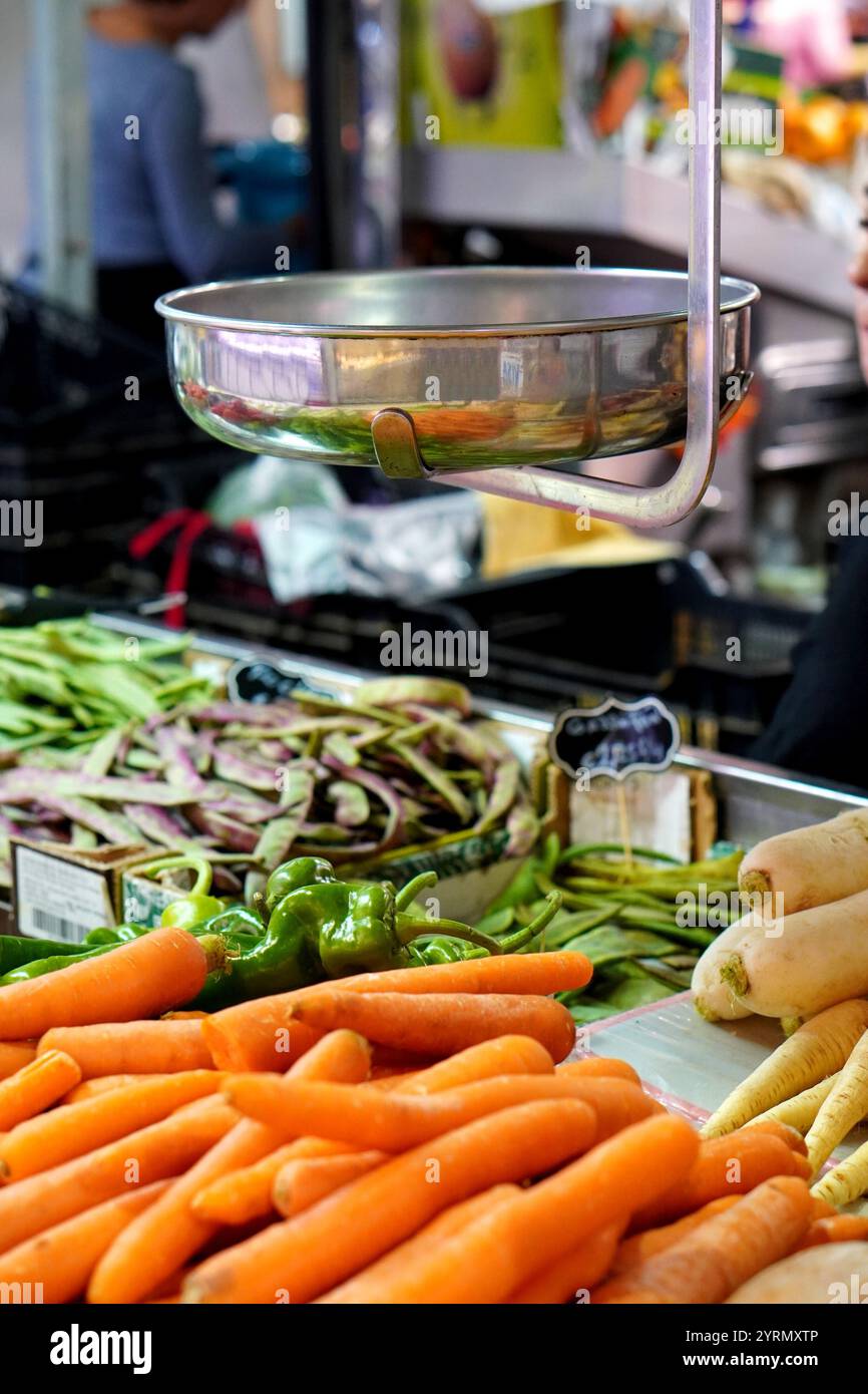 organic vegetable stall at a local market with carrots, peppers, green ...