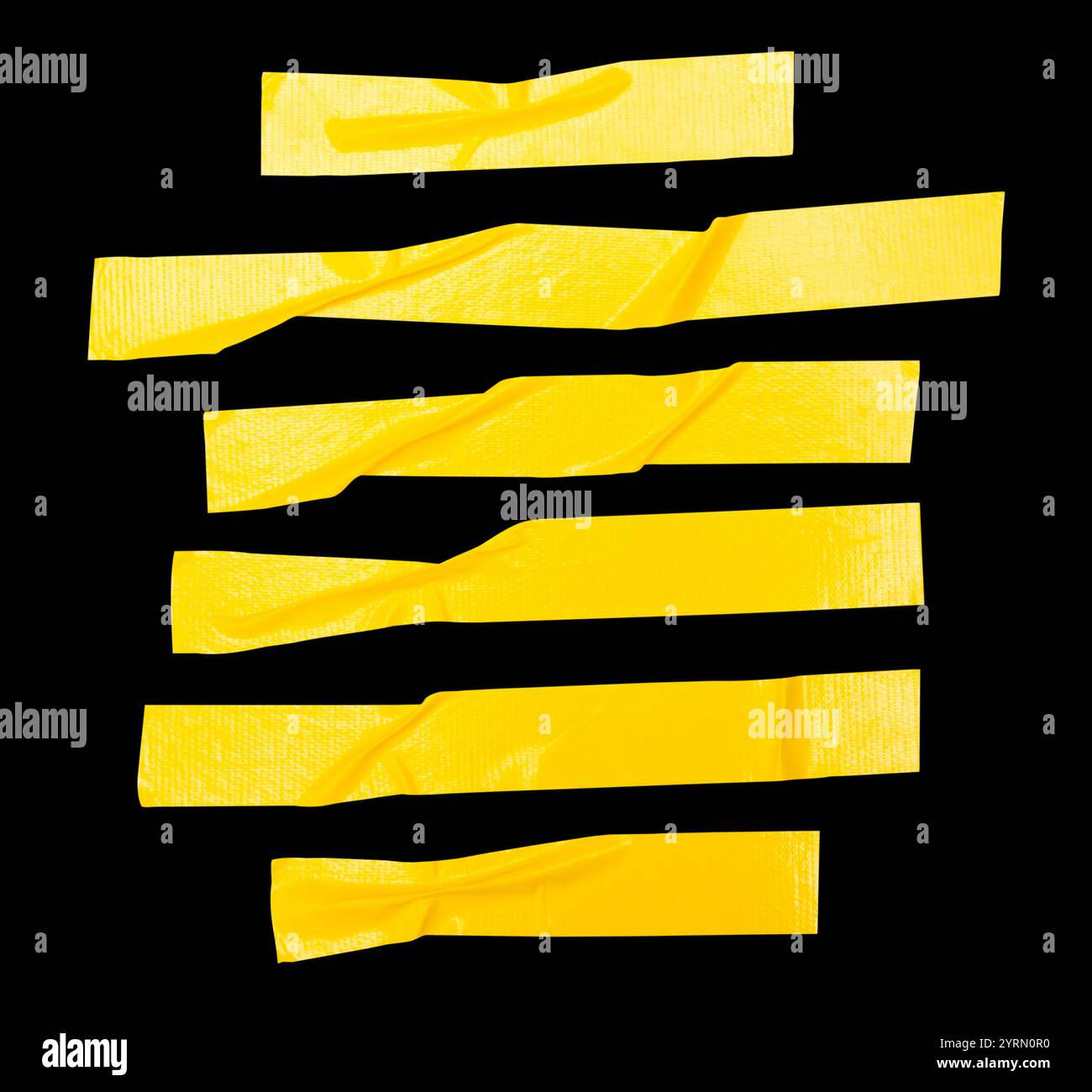 Top view set of wrinkled or crumpled yellow adhesive vinyl tape or ...