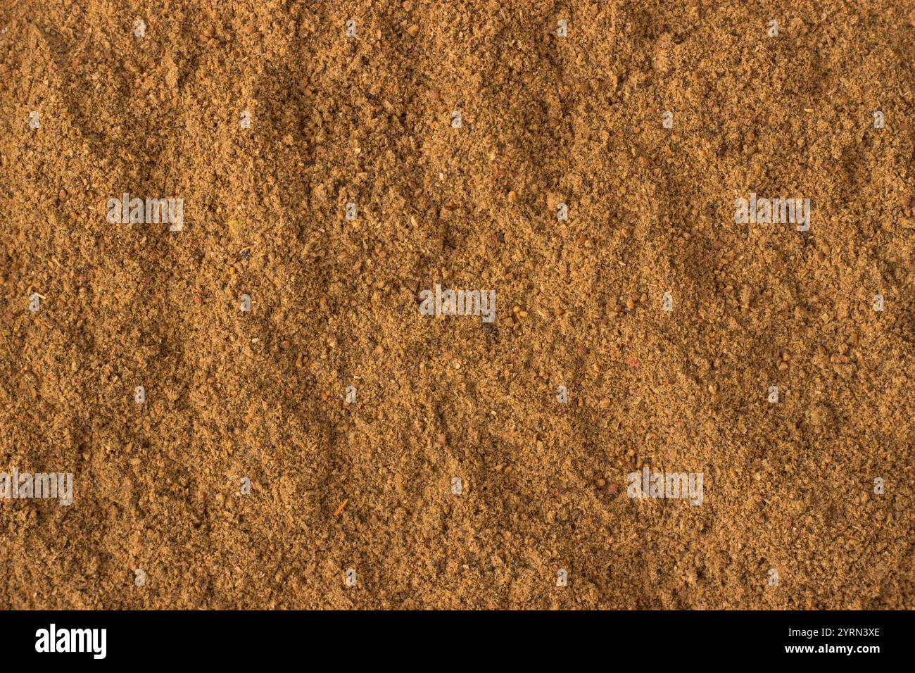 texture of ground nutmeg powder close-up, spice or seasoning as ...