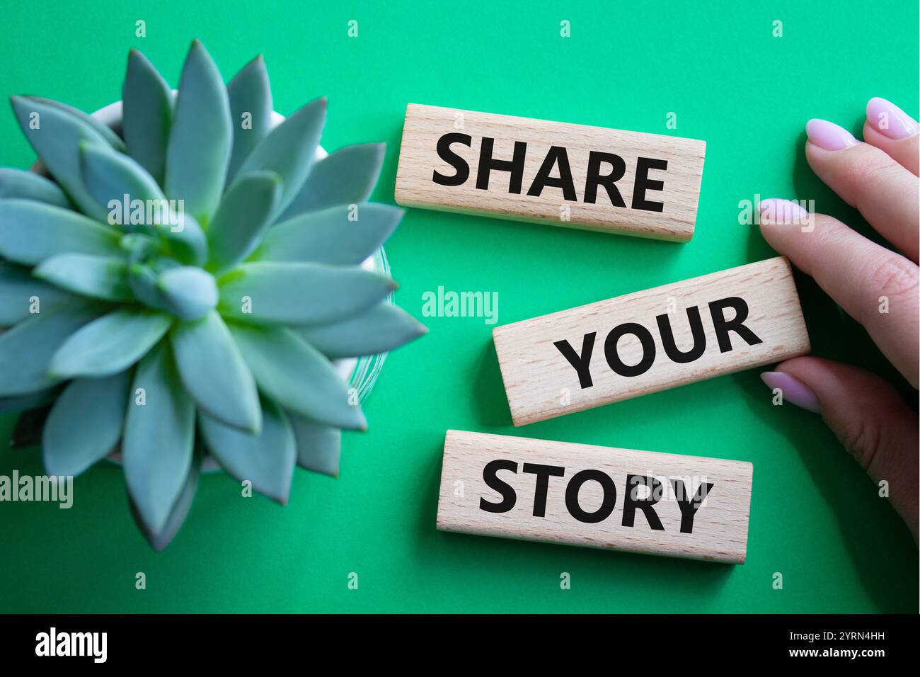 Share your story symbol. Wooden blocks with words Share your story ...