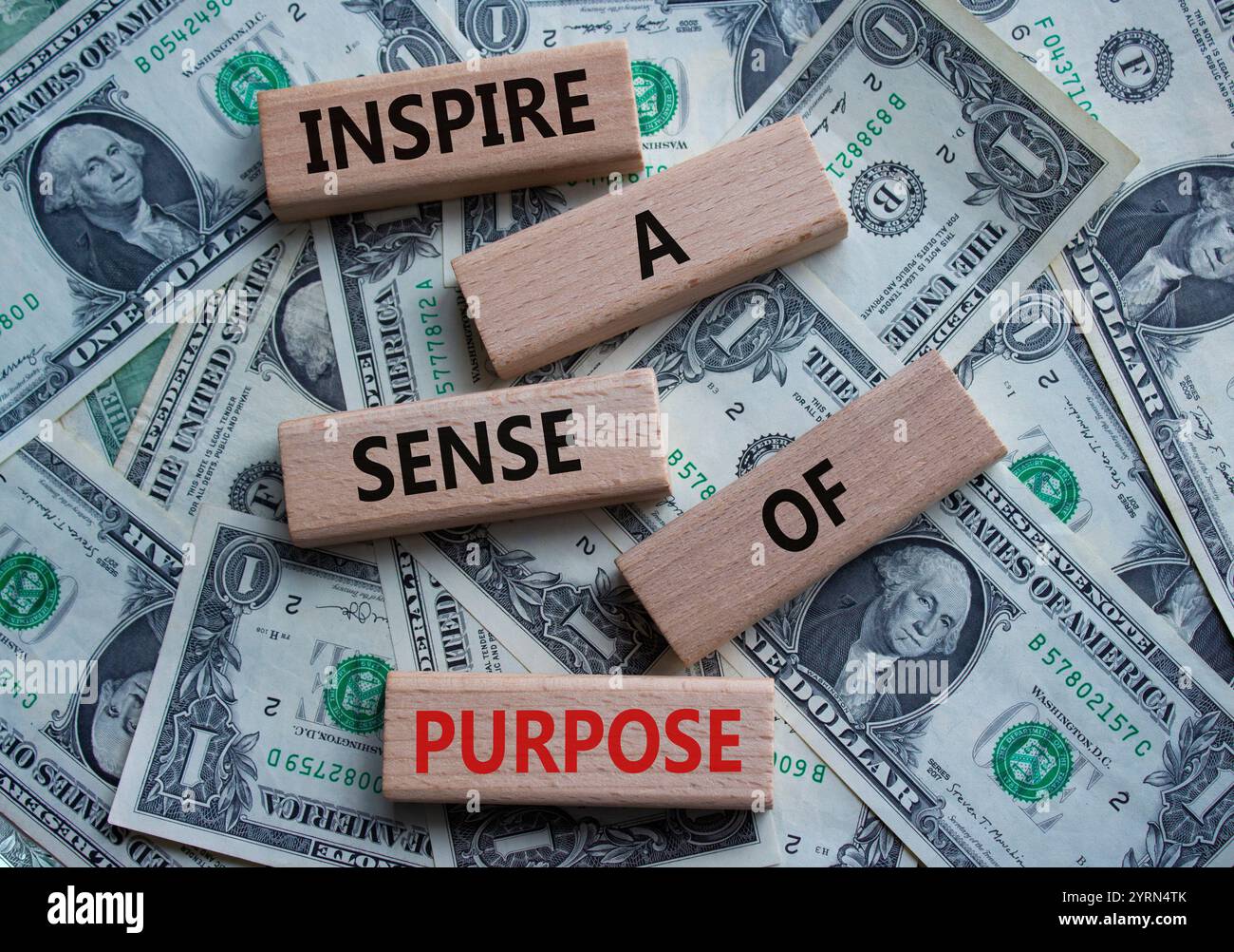 Purpose symbol. Wooden blocks with words Inspire a sense of Purpose ...