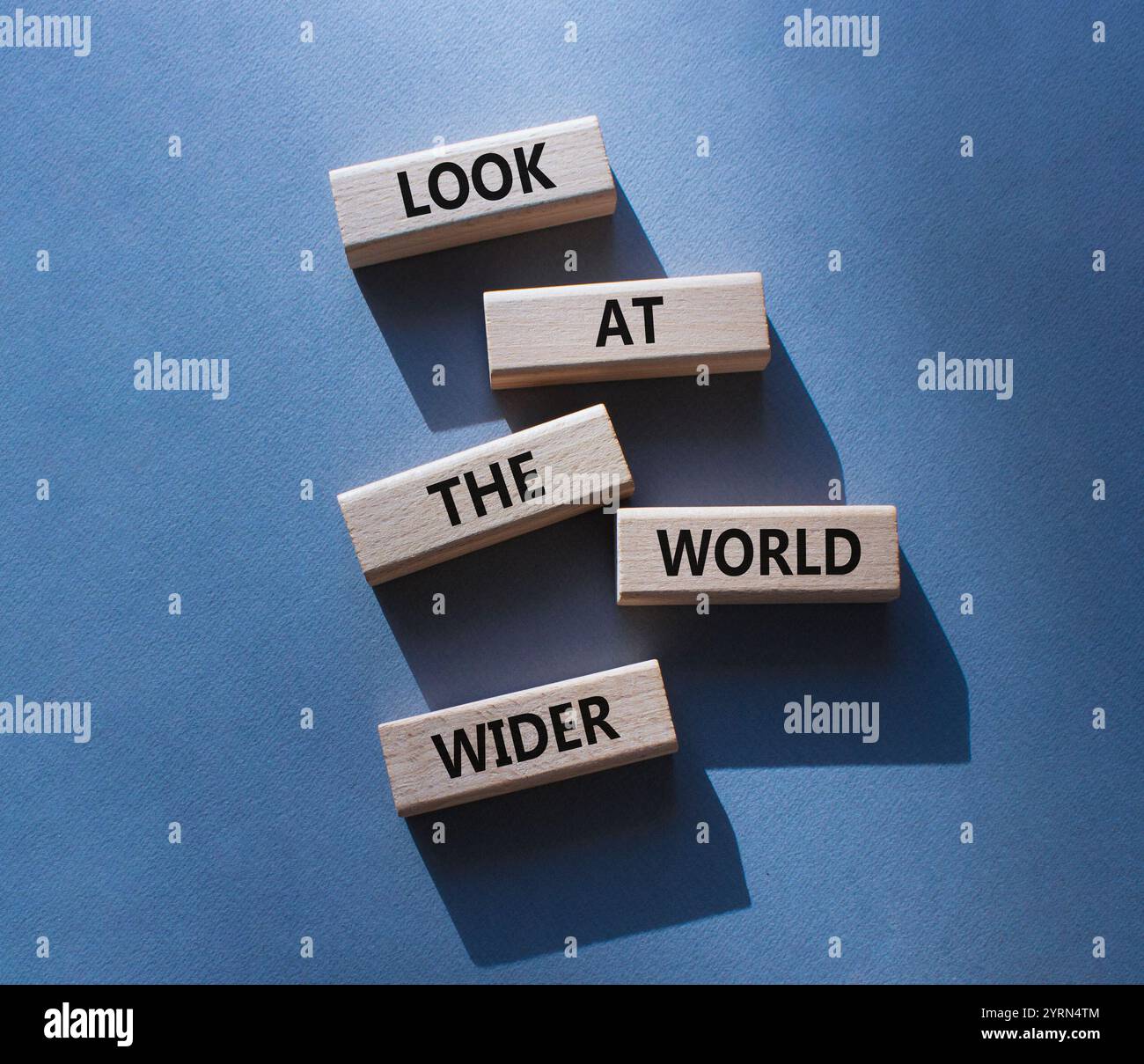 Look at the world wider symbol. Wooden blocks with words Look at the ...