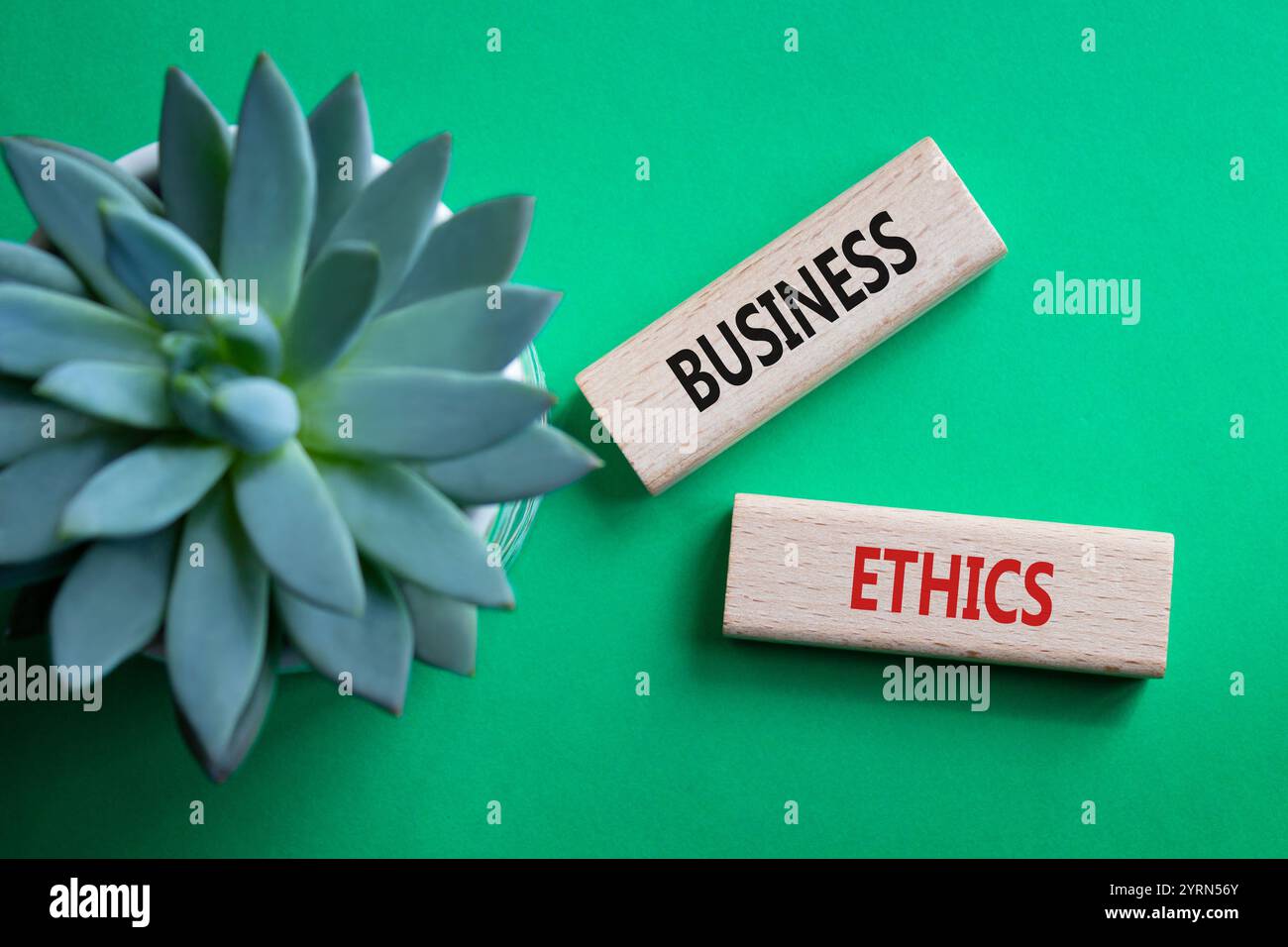 Business ethics symbol. Concept word Business ethics on wooden blocks ...