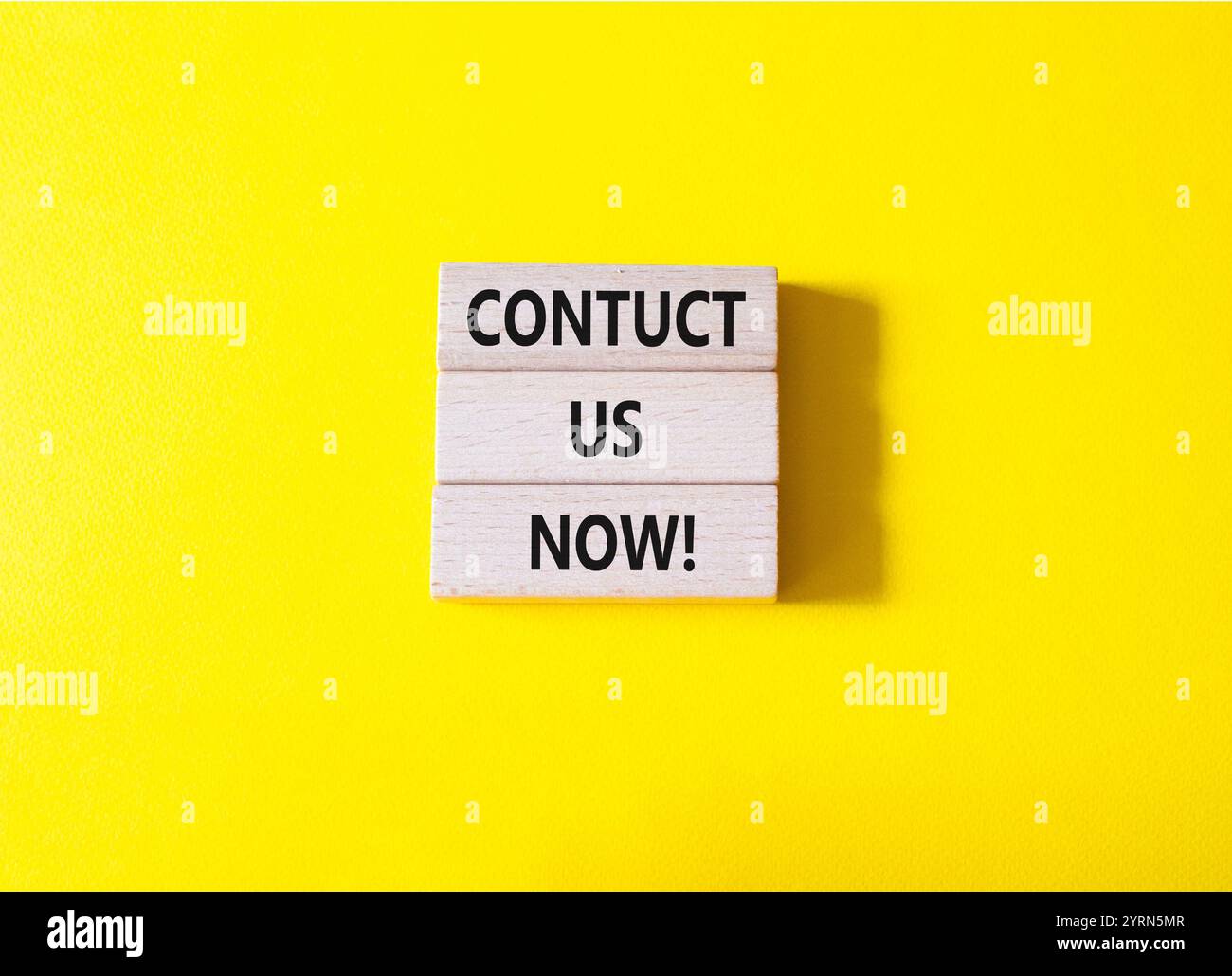 Contact us now symbol. Wooden blocks with words Contact us now ...