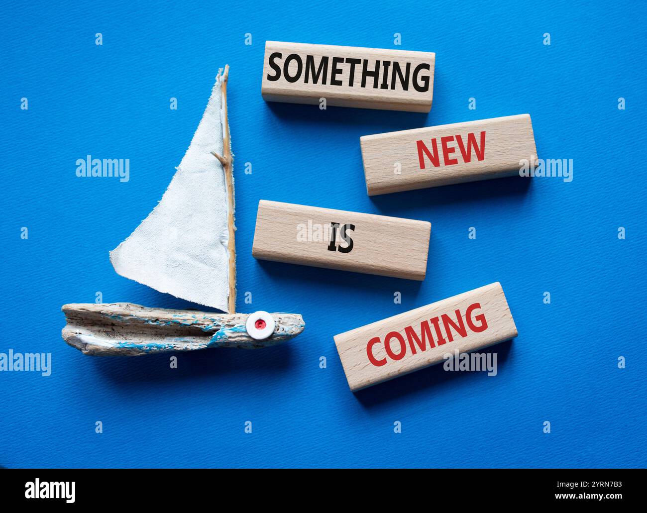 Smth New is coming symbol. Wooden blocks with words Something New is ...