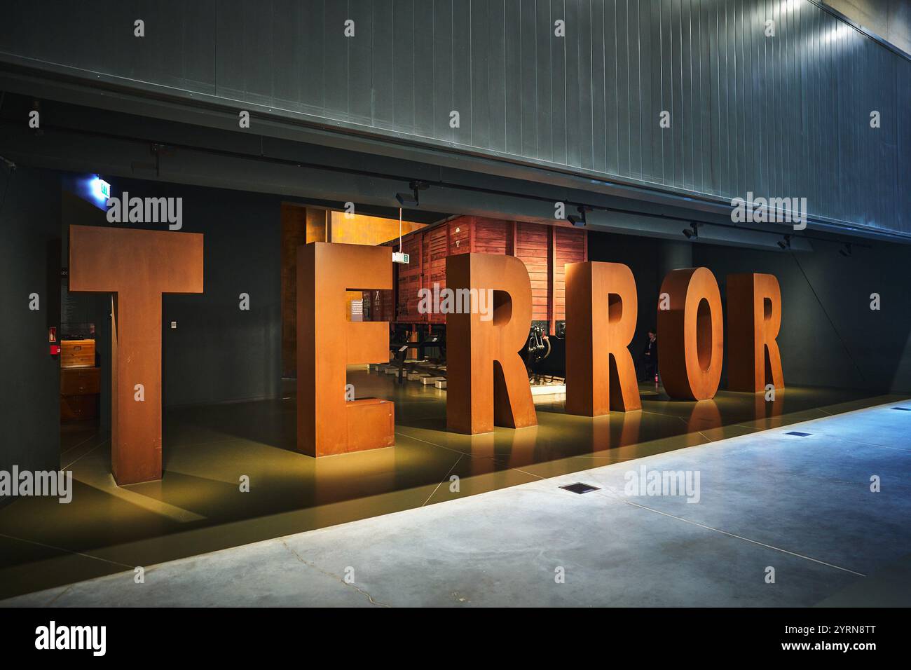 A large display of the word 'TERROR' made from rusted metal letters ...