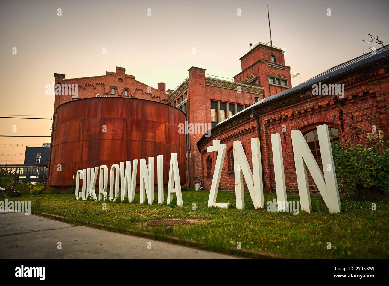 A historic industrial building in Znin, Poland, featuring large white ...