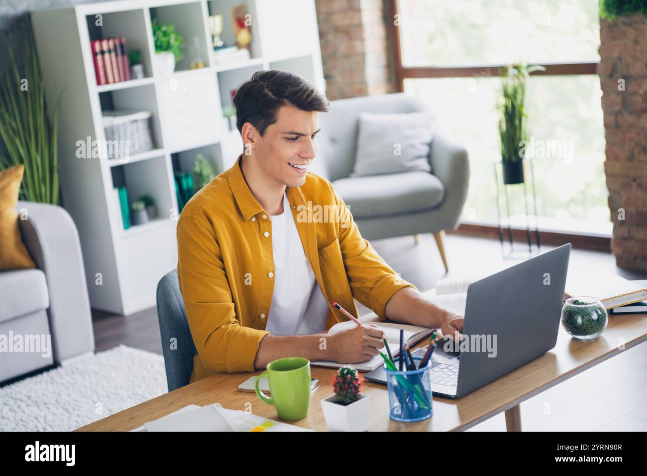 Handsome young guy happily resting hi-res stock photography and images ...